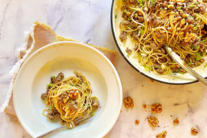 Spaghetti with Sausage, Walnut + Green Onion Ragu - California Walnuts